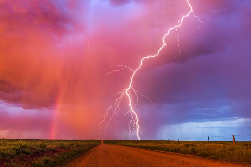 Monsoon sunset lightning with a rainbow
