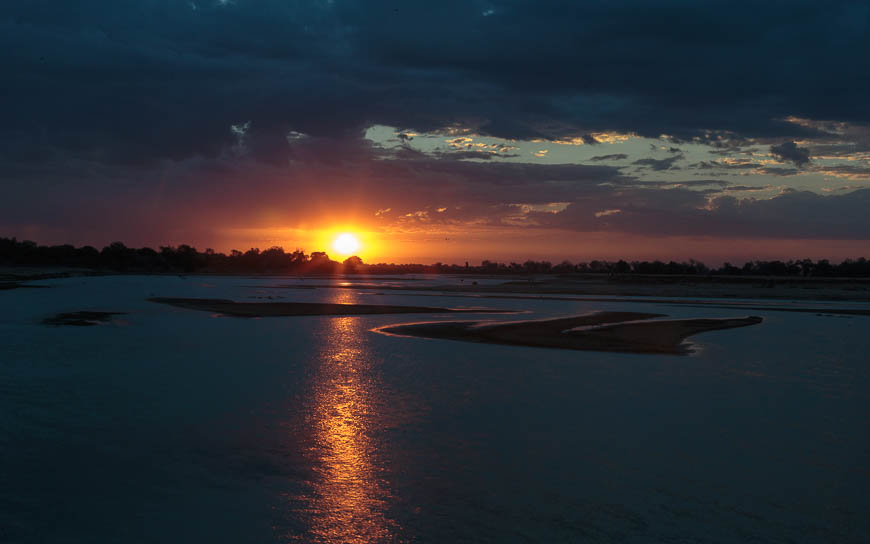 As day fades rapidly into dusk, and dusk into night, the African bush ...
